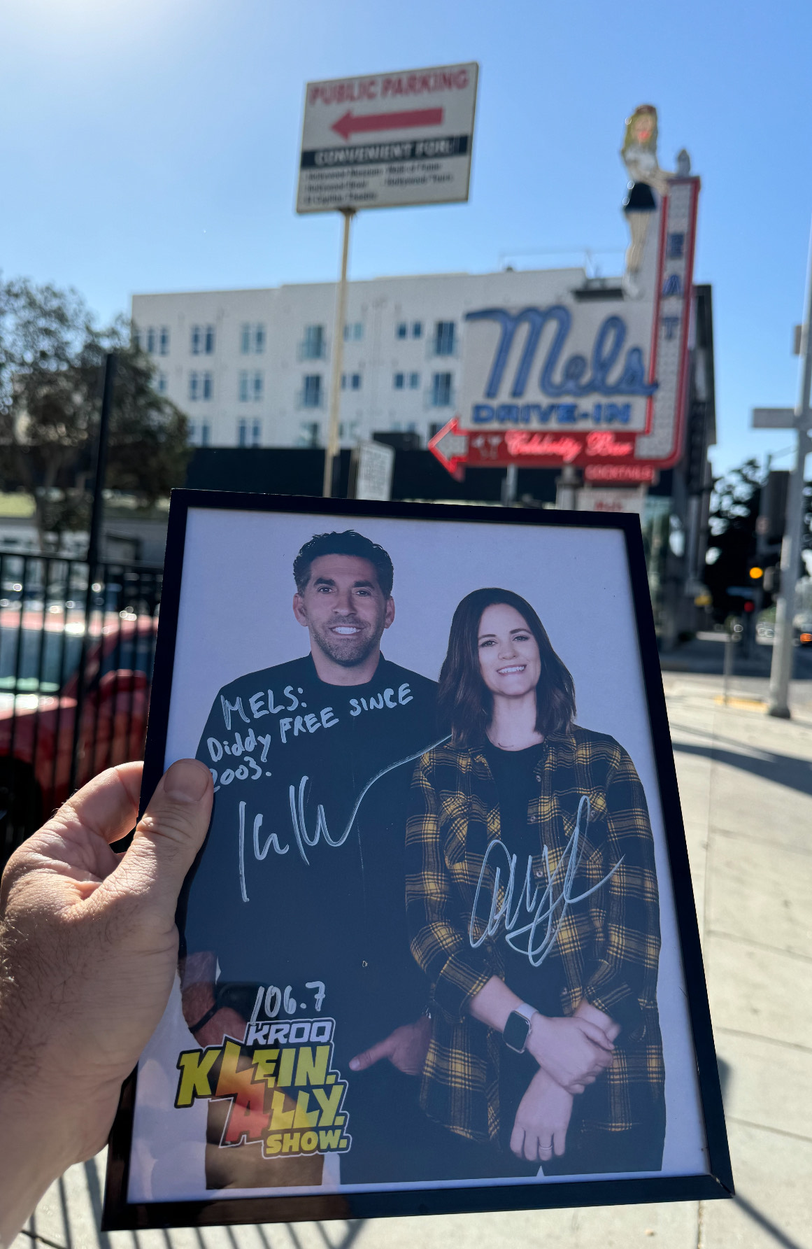 KROQ's morning show replaces Diddy photo at Mel's Hollywood | Audacy Inc.